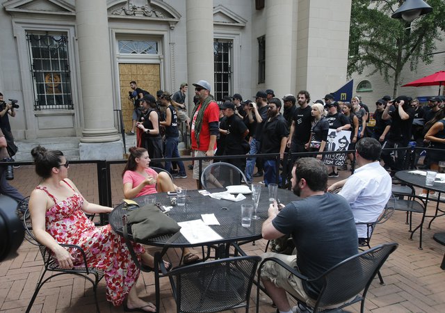 Tense confrontation amid peaceful vigils in Charlottesville ...